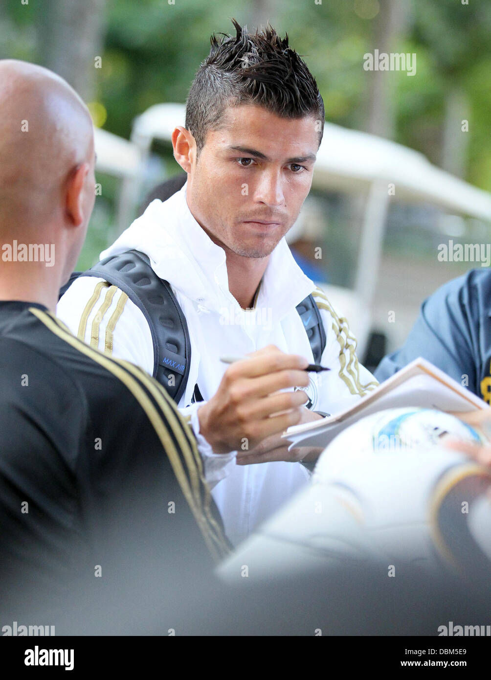 Real Madrid forward Cristiano Ronaldo signs autographs for fans as he ...