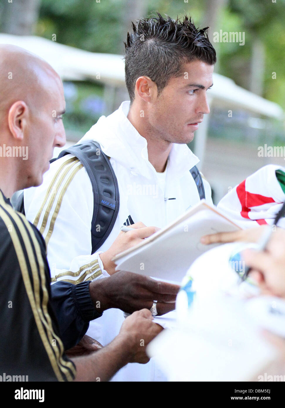 Real Madrid forward Cristiano Ronaldo signs autographs for fans as he ...