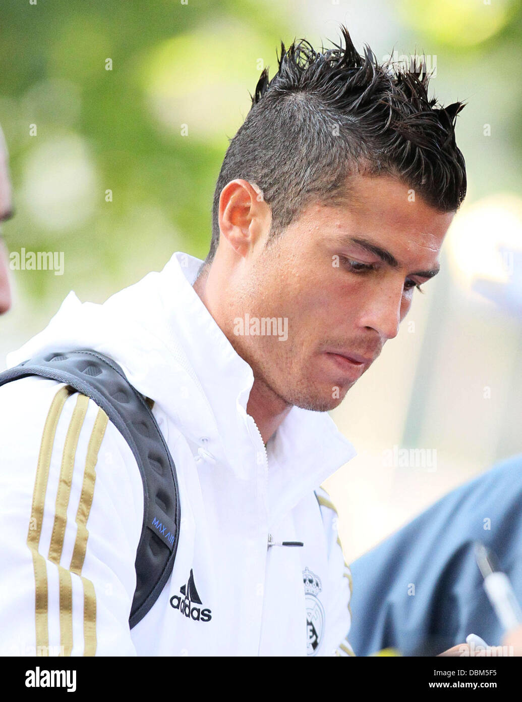 Real Madrid forward Cristiano Ronaldo signs autographs for fans as he ...