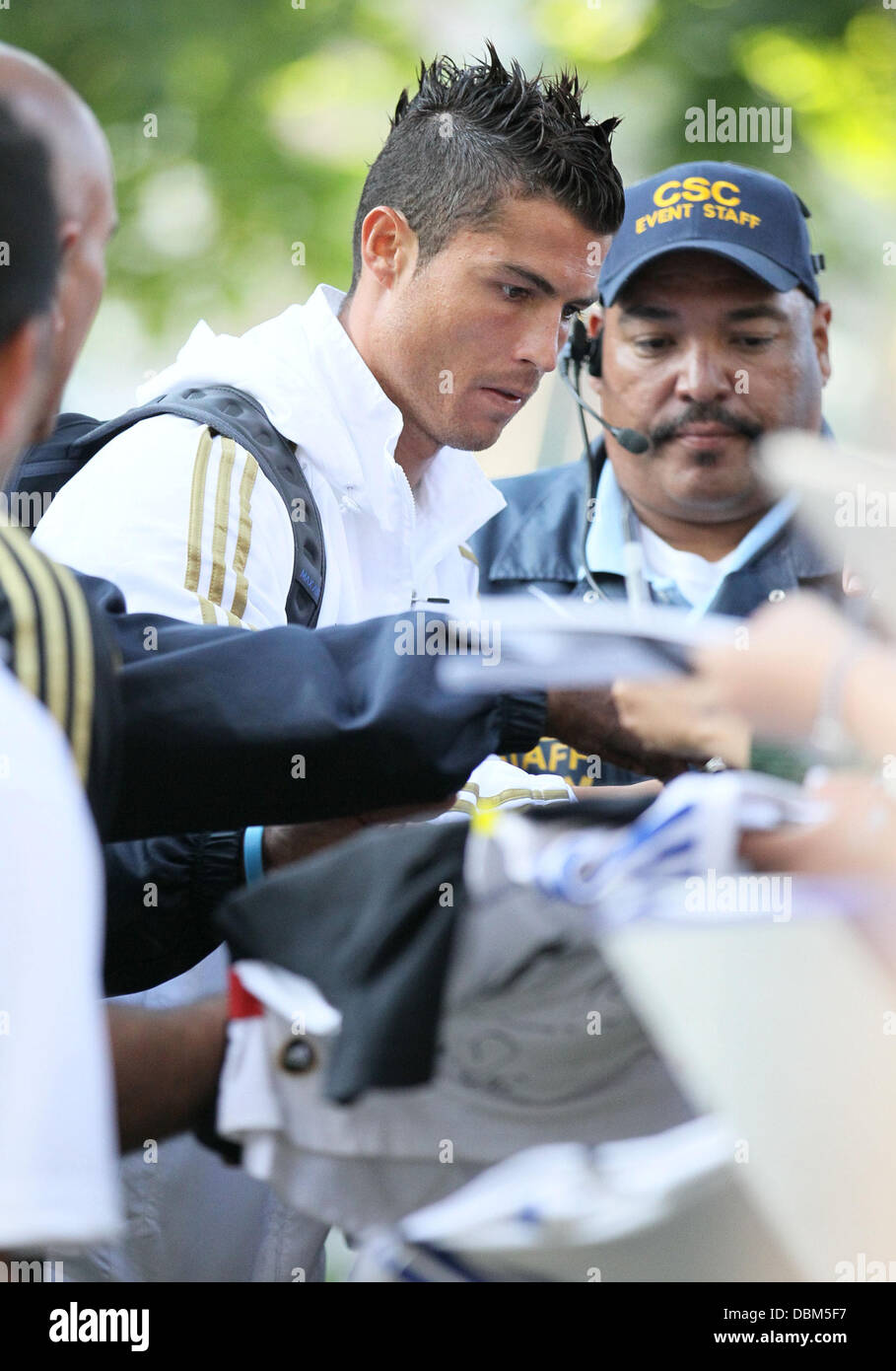 Real Madrid forward Cristiano Ronaldo signs autographs for fans as he ...