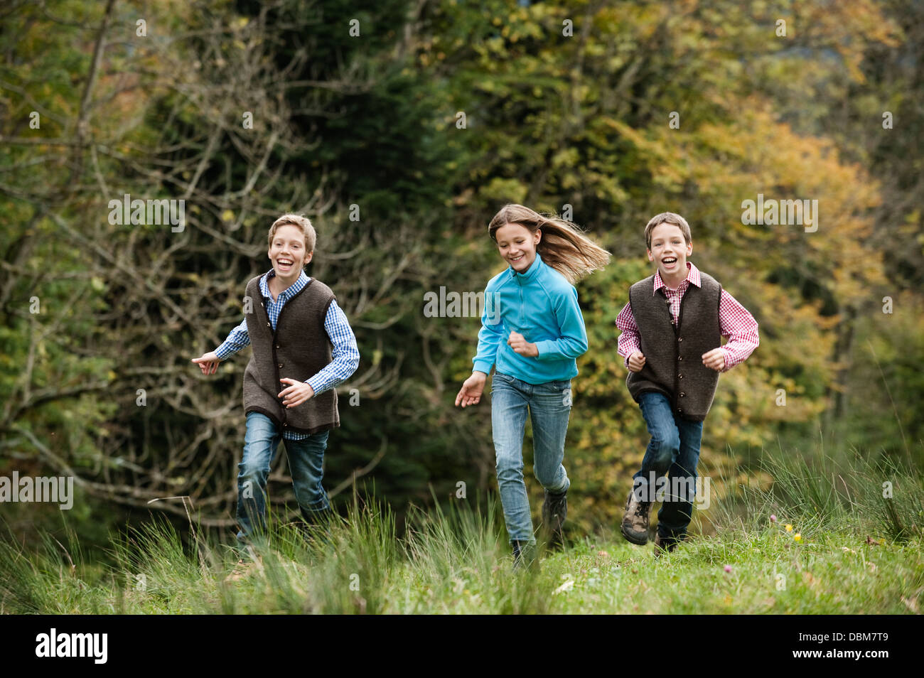 Three Children Running In Forest, Bavaria, Germany, Europe Stock Photo ...