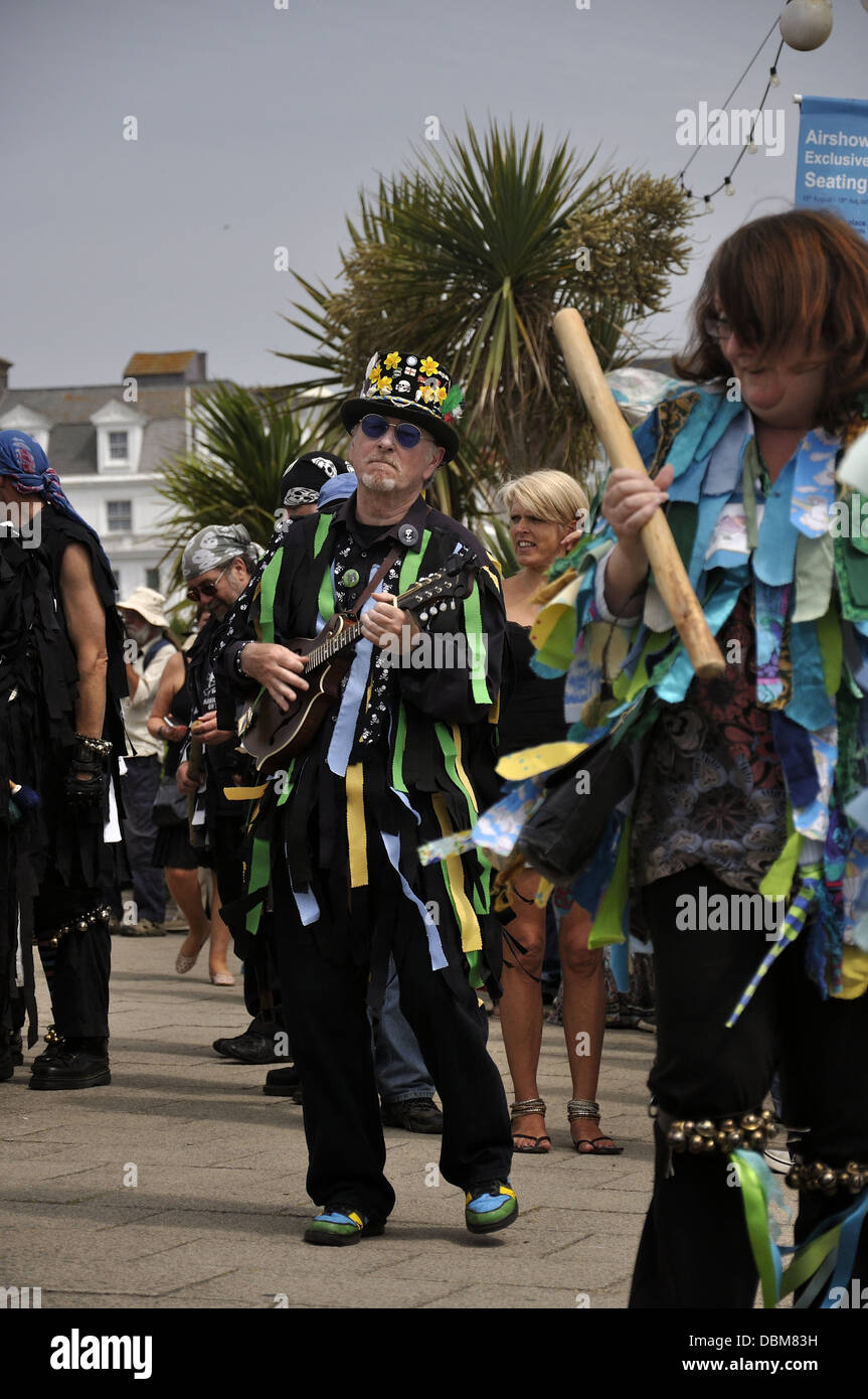 Banjo playing morris man in costume Stock Photo - Alamy