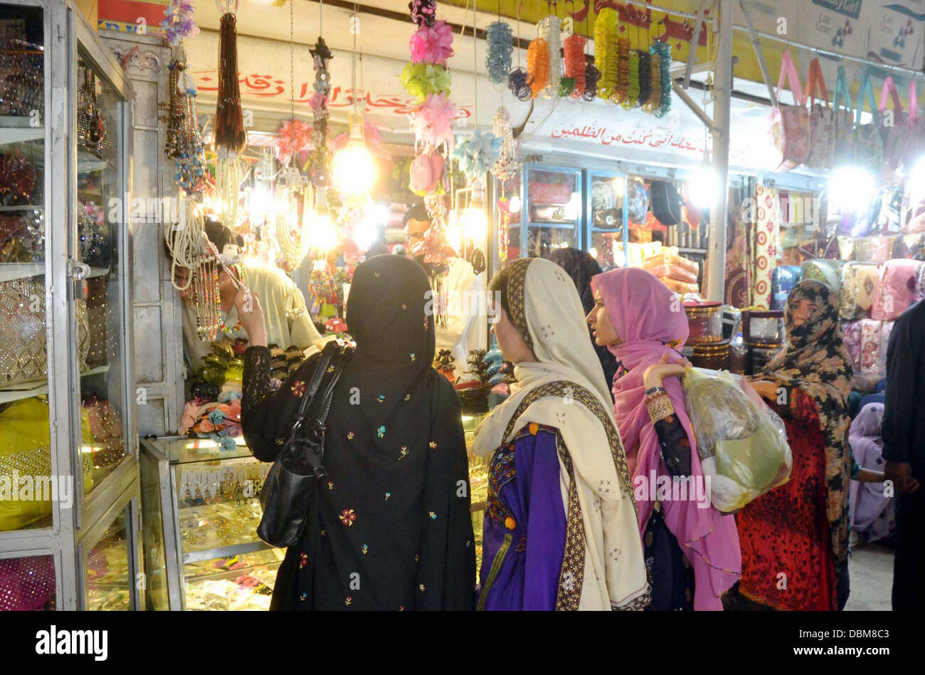 People busy in Eid shopping at market ahead of Eid- ul-Fitar during the ...