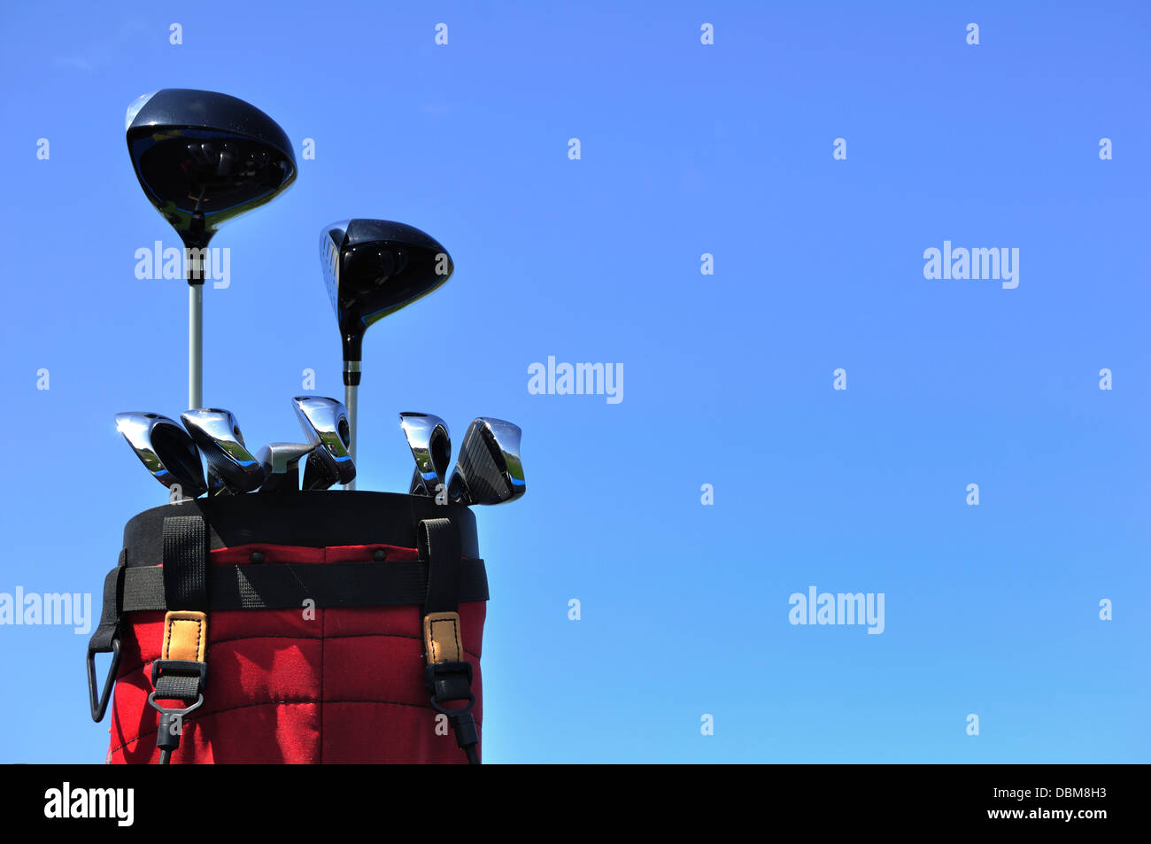 Golf Clubs in a Red Bag, putter, irons, driver and 3 wood Stock Photo ...