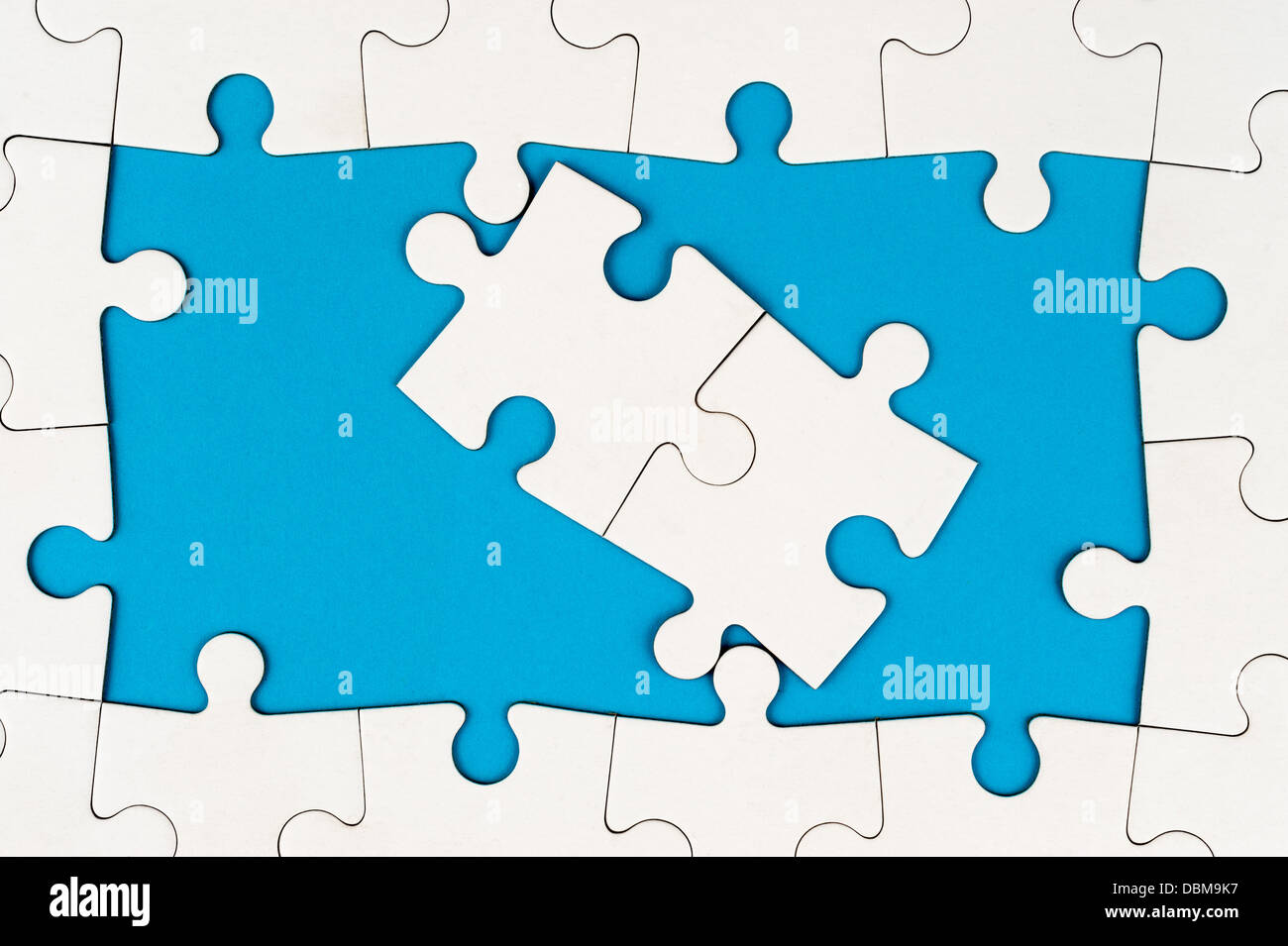 Group of white paper jigsaw puzzles Stock Photo - Alamy
