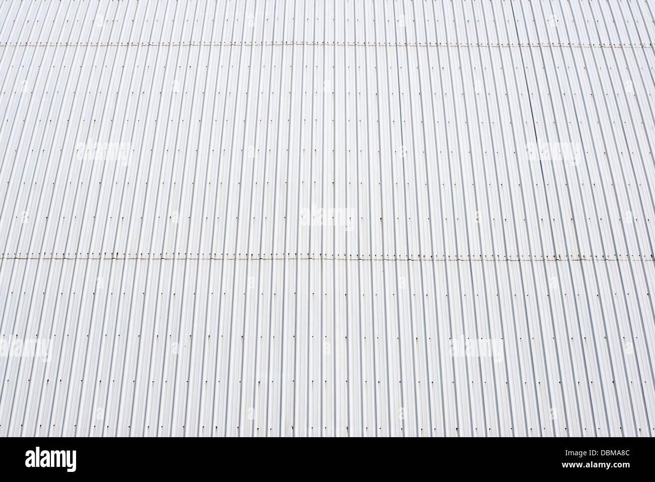 abstract background created by the surface of a metal roof industrial ...