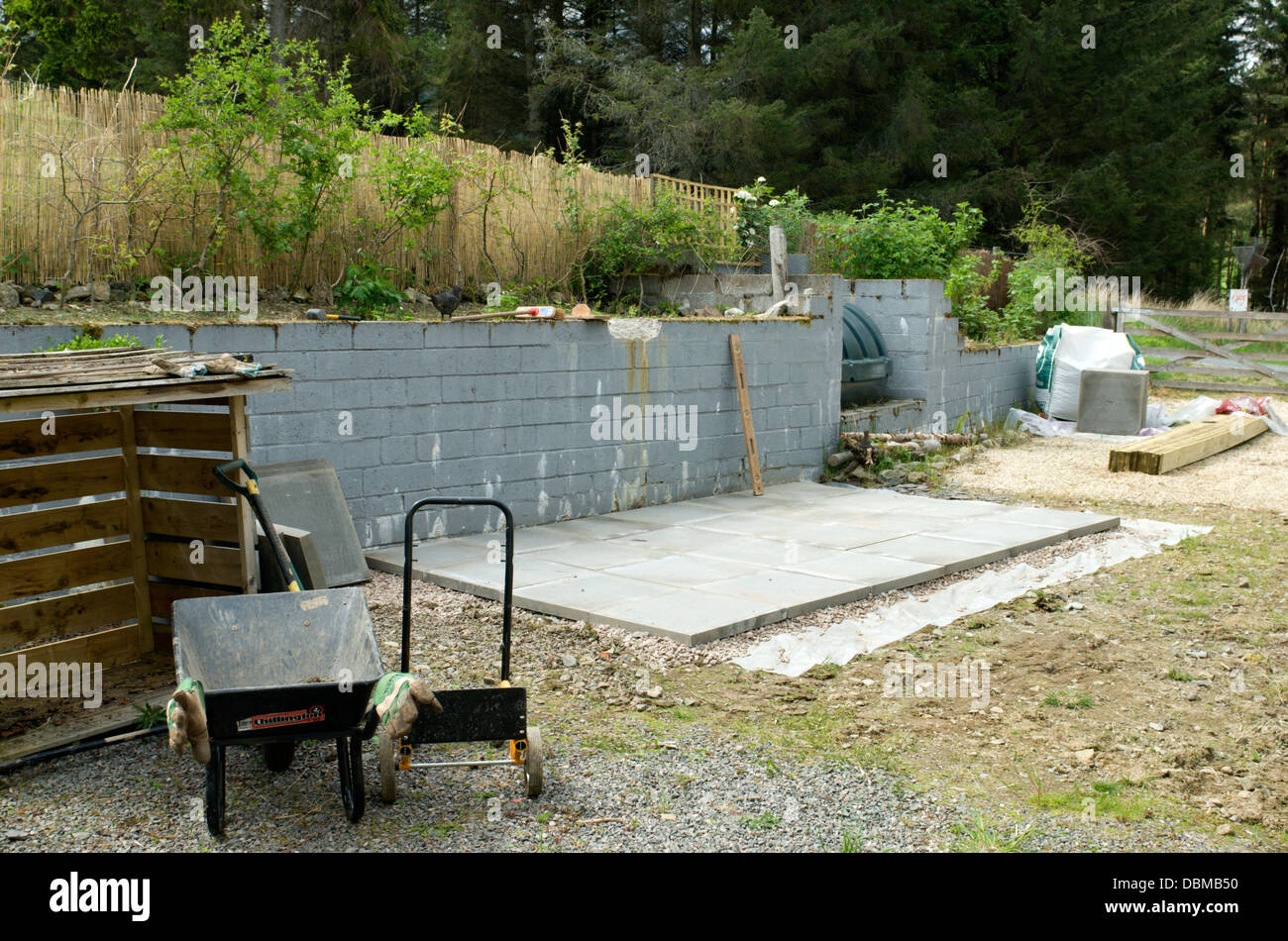 Slabs laid ready for a shed base in a garden DIY project Stock Photo ...