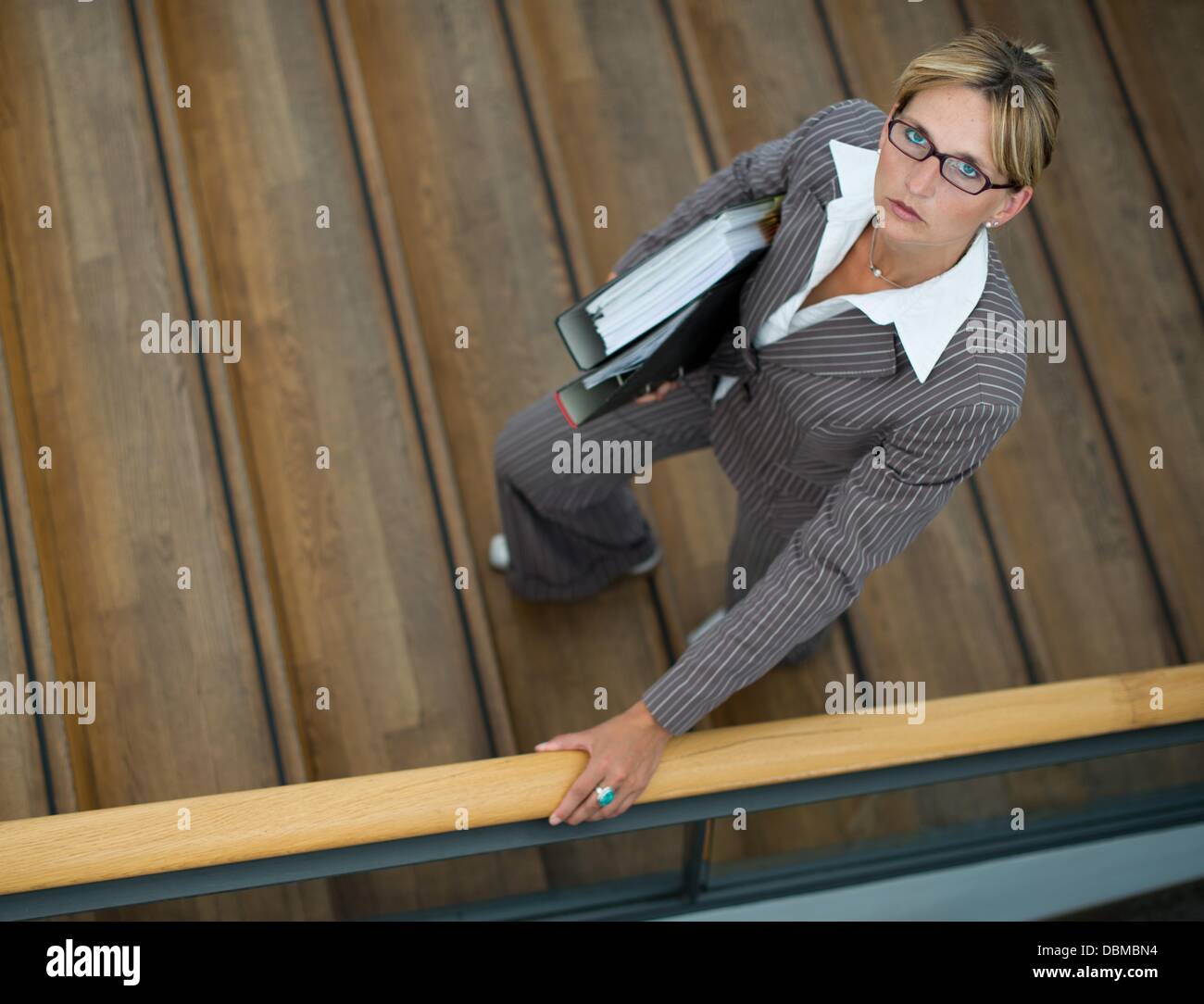 (ILLUSTRATION) An illustration shows a business woman with folders ...