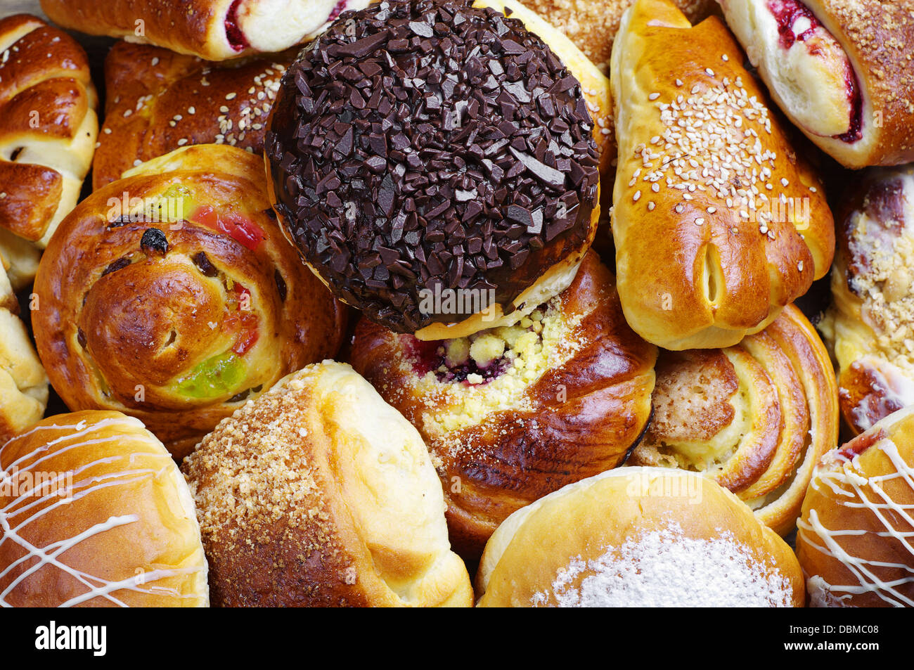Background of different sweet buns Stock Photo - Alamy
