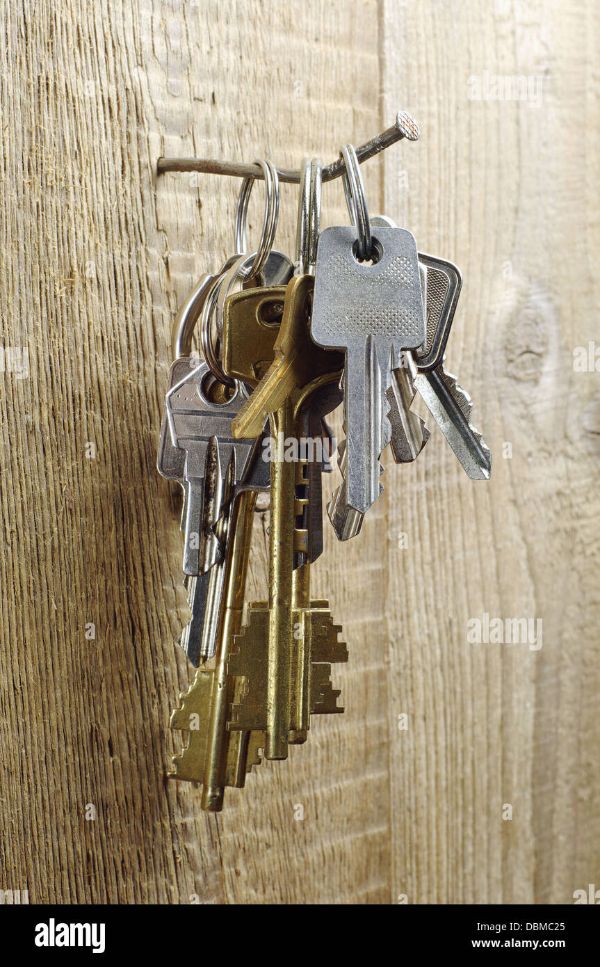 Different old keys on a wooden background Stock Photo - Alamy