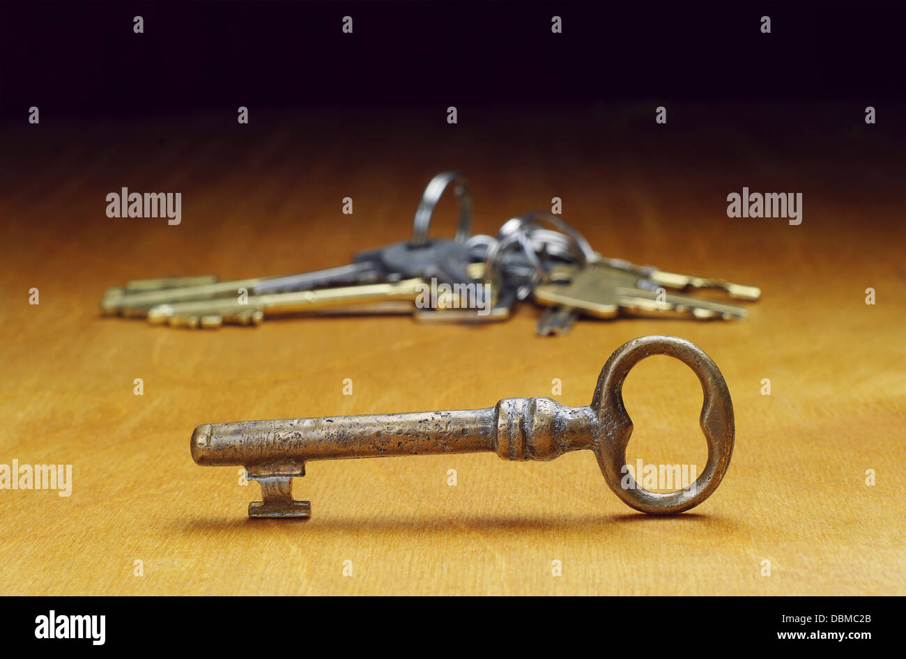 Antique bronze keys wooden background hi-res stock photography and ...