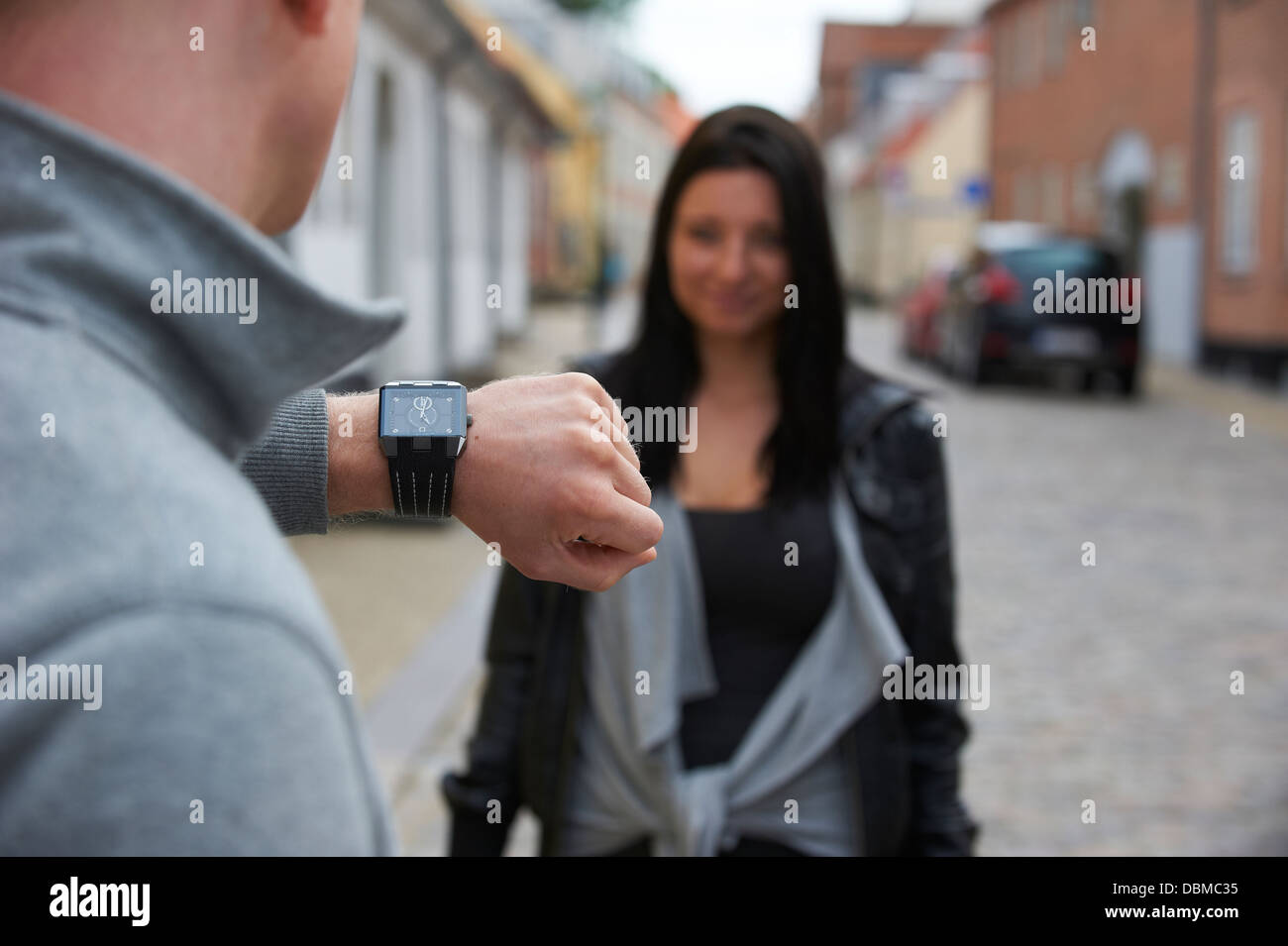 Girlfriend arriving too late again Stock Photo - Alamy