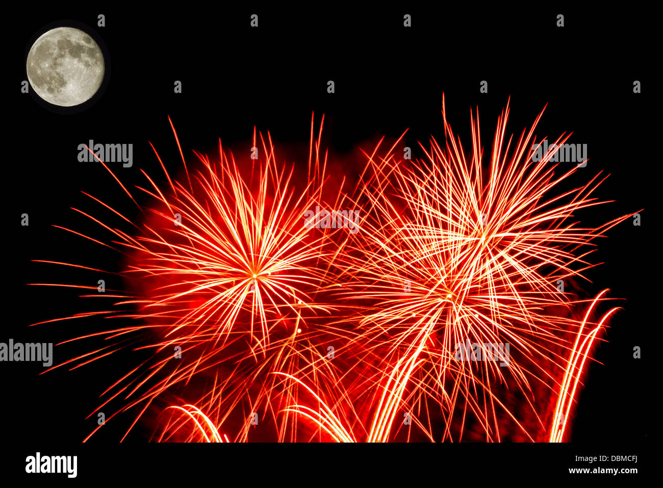 Amazing fireworks with the full moon in a dark night Stock Photo - Alamy