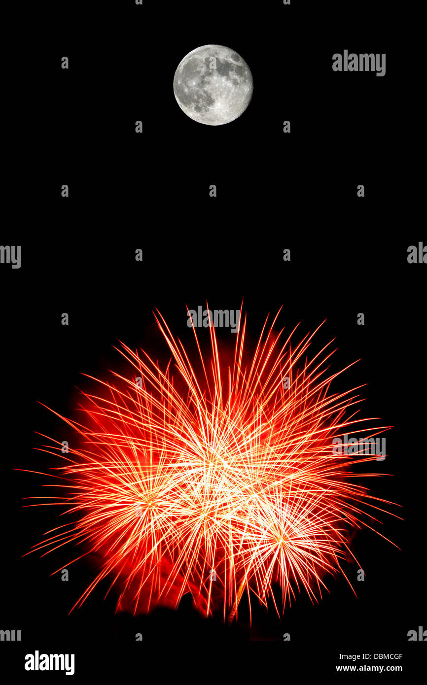 Amazing fireworks with the full moon in a dark night Stock Photo - Alamy