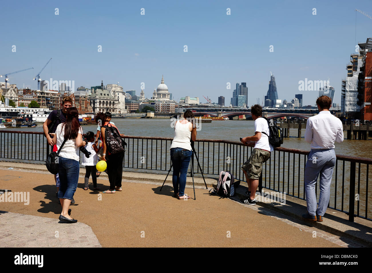 tourists taking photos at viewpoint on the south bank of the river ...