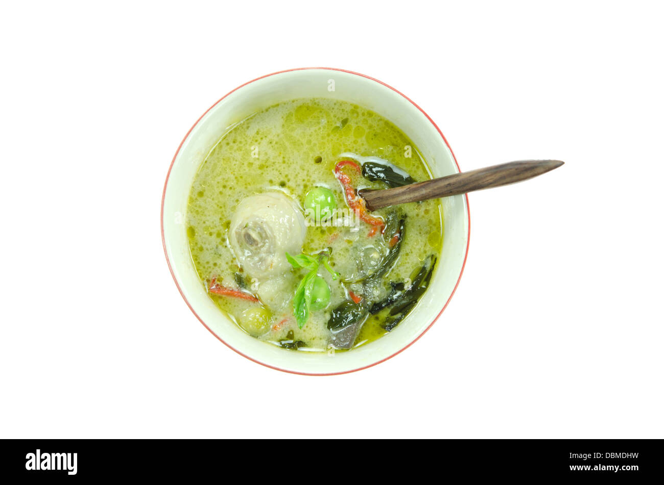 top view green chicken curry in bow with wooden spoon over white Stock ...