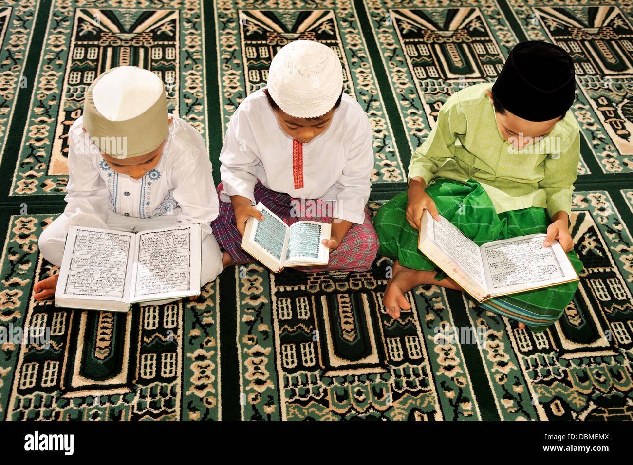 Children reading Koran Stock Photo - Alamy