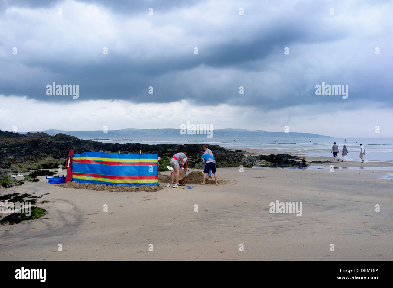 A family dig together on Gwithian Beach, North Cornwall. Picture by ...