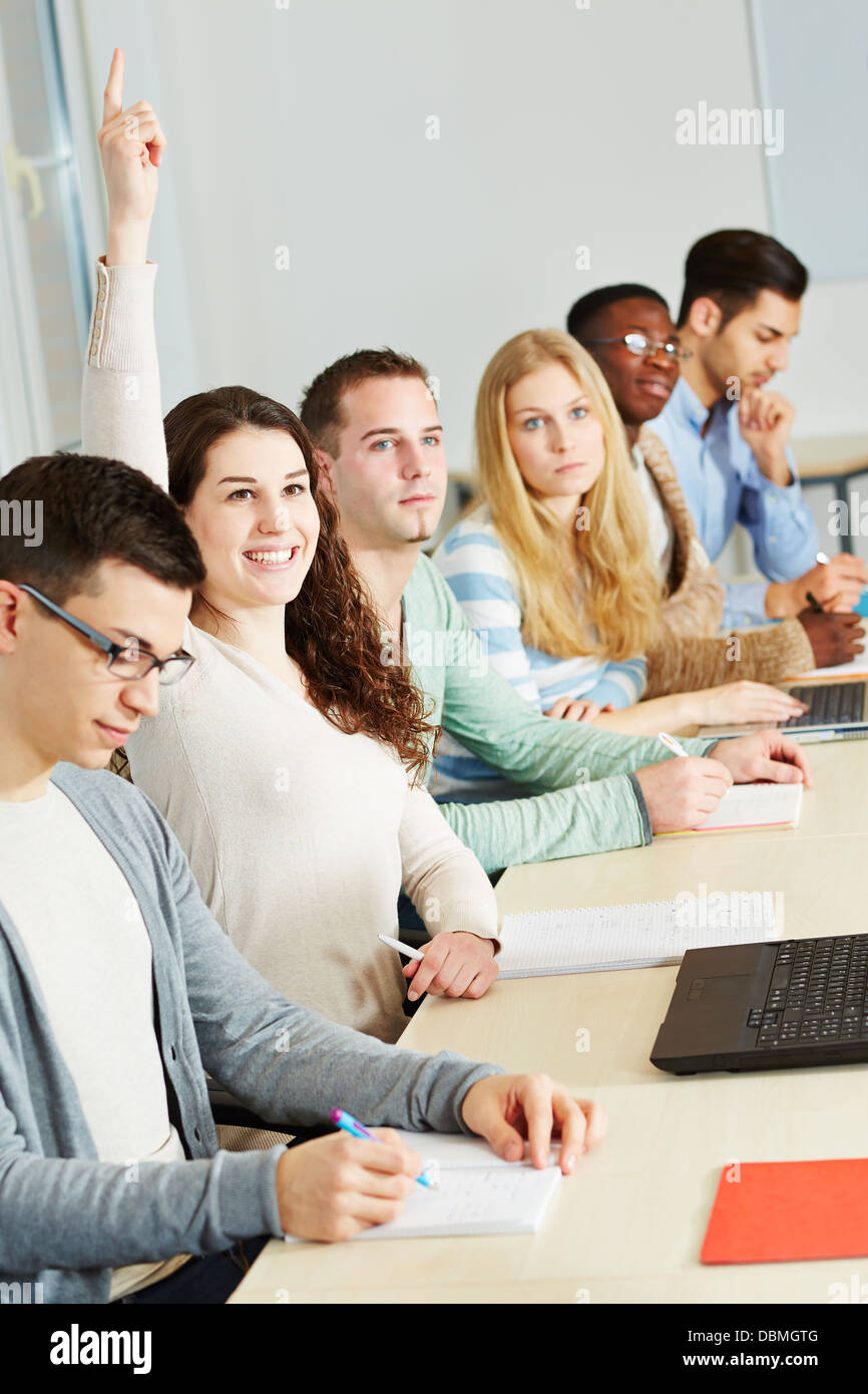 Female university student raising hand hi-res stock photography and ...