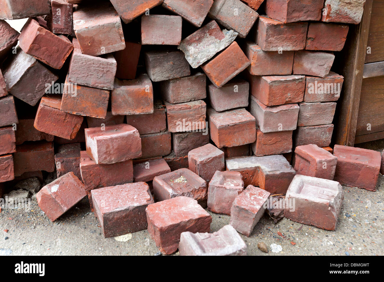 Pile of red construction bricks Stock Photo - Alamy