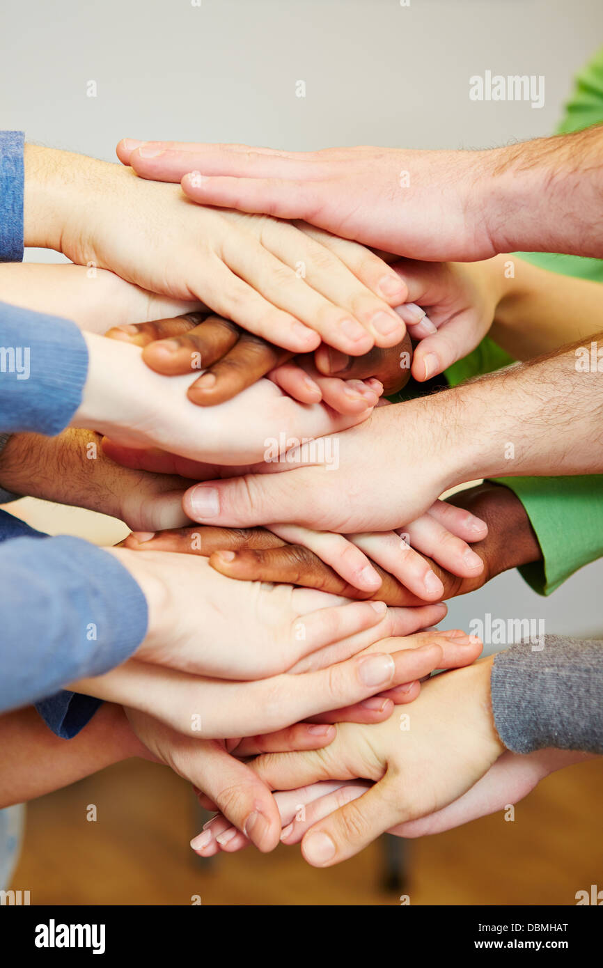 Team stacking many hands on top of each other for motivation Stock ...