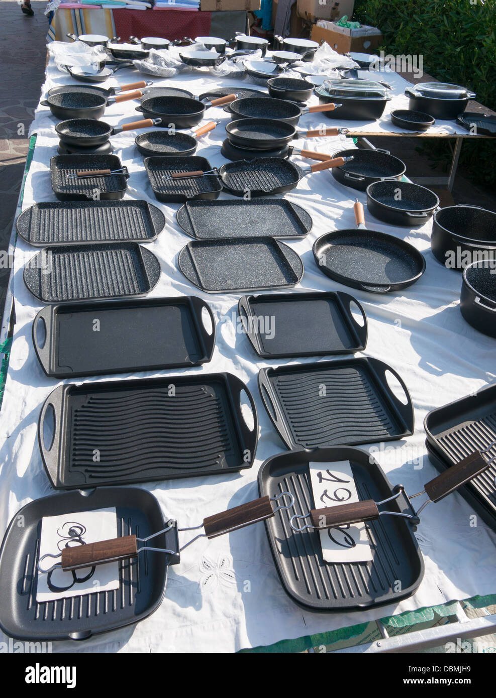Cooking pots and griddles for sale, market stall at Ceriale, northern ...