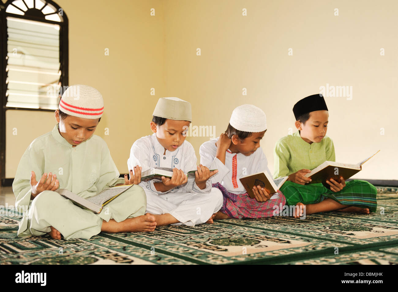 Children reading Koran Stock Photo - Alamy