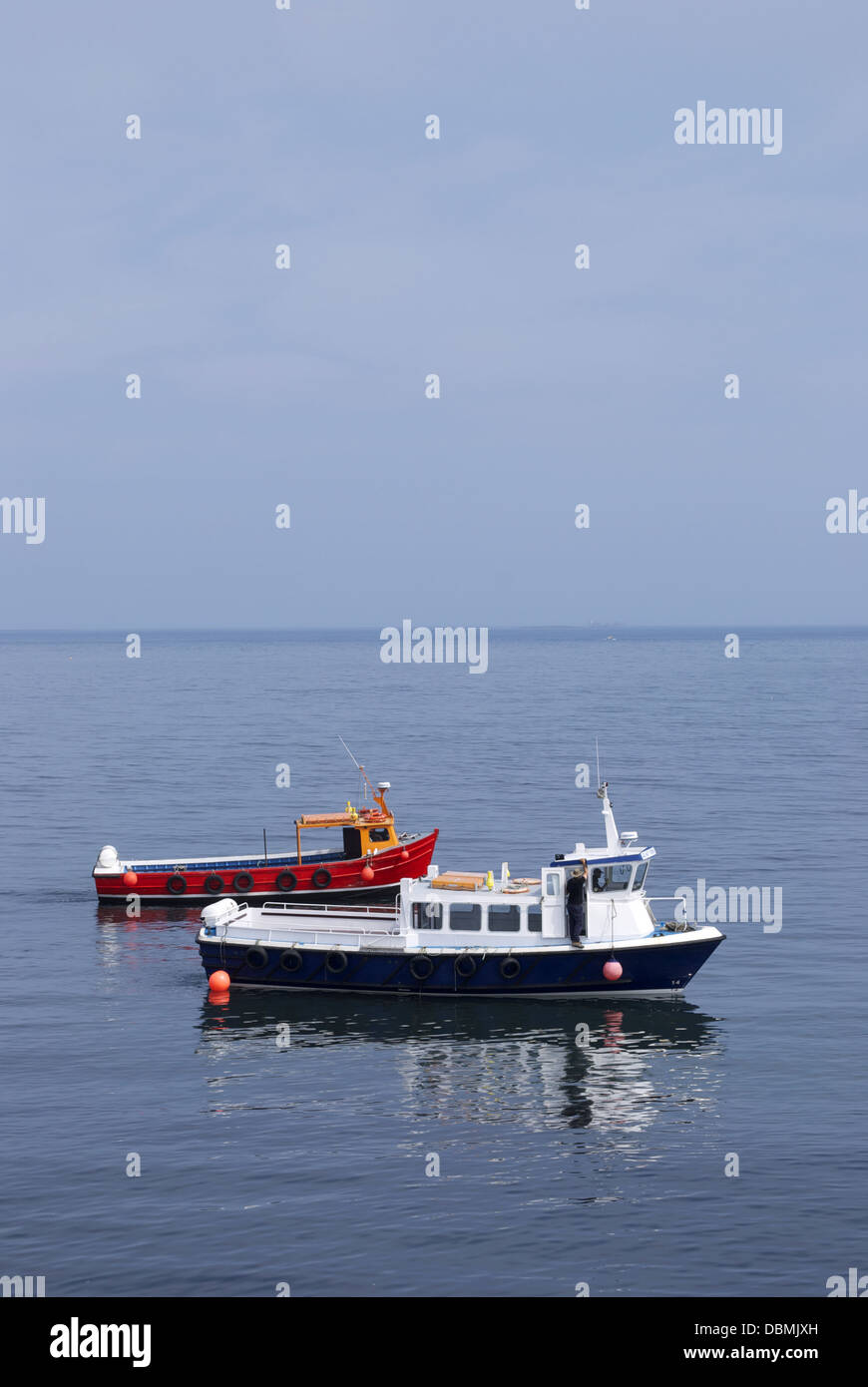 Red boat blue boat Stock Photo - Alamy