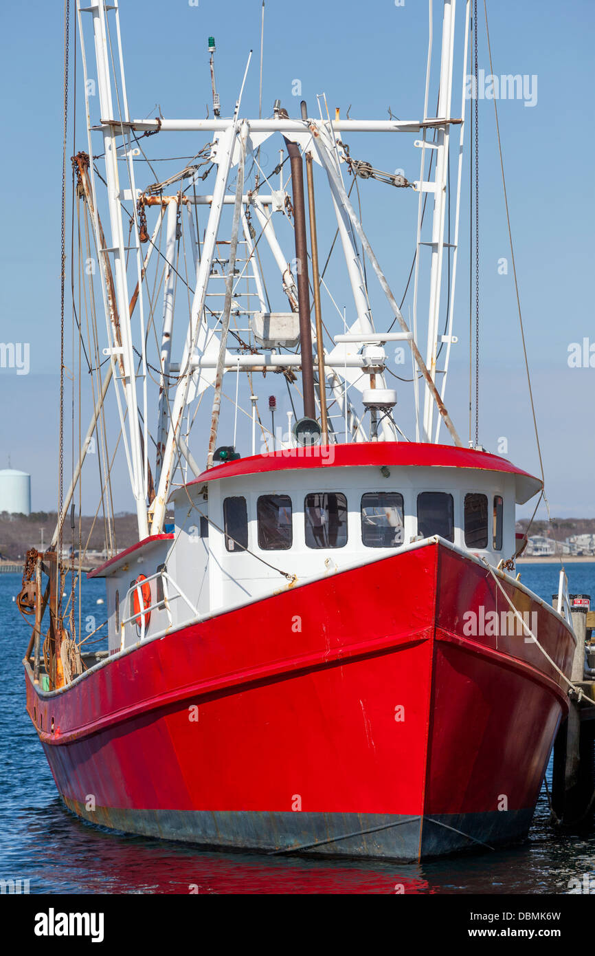 Fisherman boat by the dock in the bay by the ocean Stock Photo - Alamy