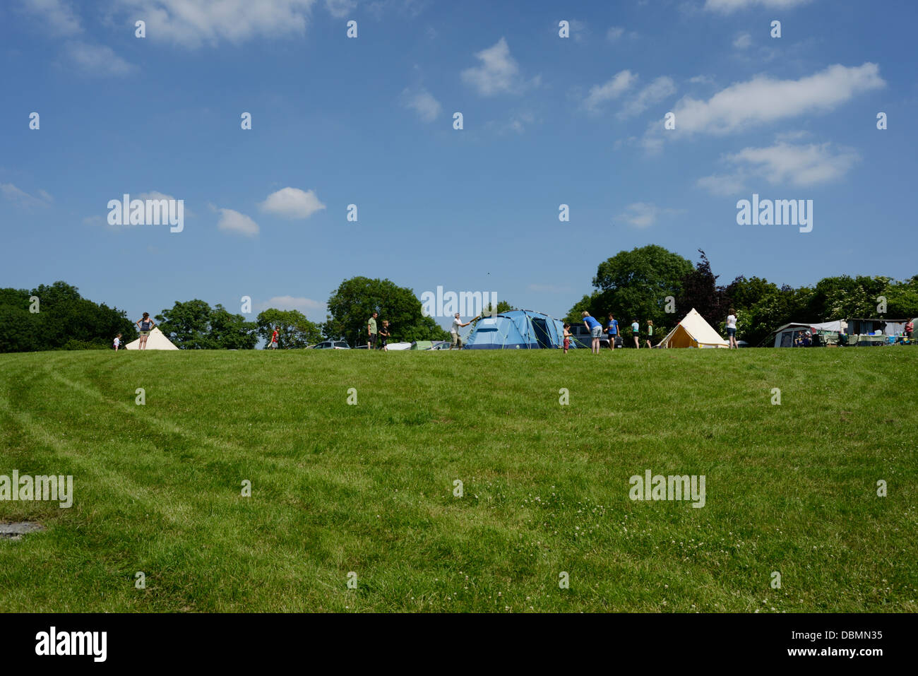 Camp site with tents in an open field, Blue sky, England, Britain, UK ...