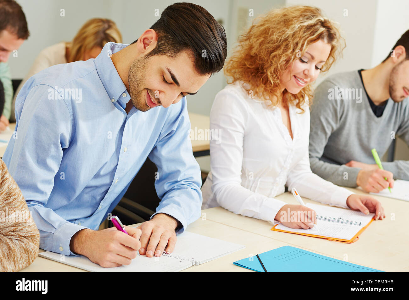 Man and woman taking employee screening in assessment center Stock ...
