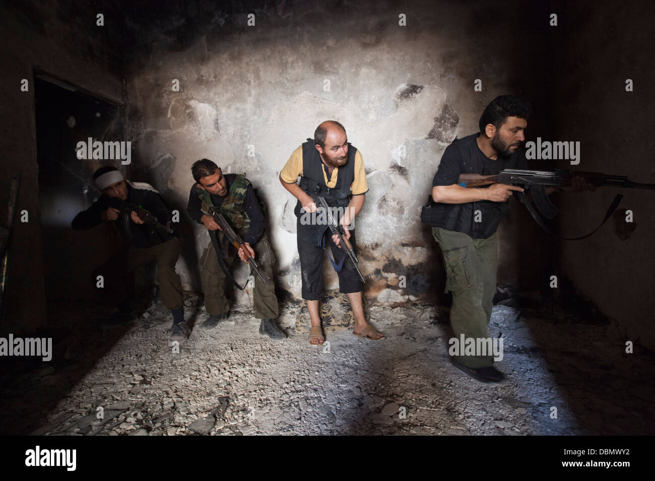 Aleppo, Syria: A Free Syrian Army member takes aim at a regime position ...