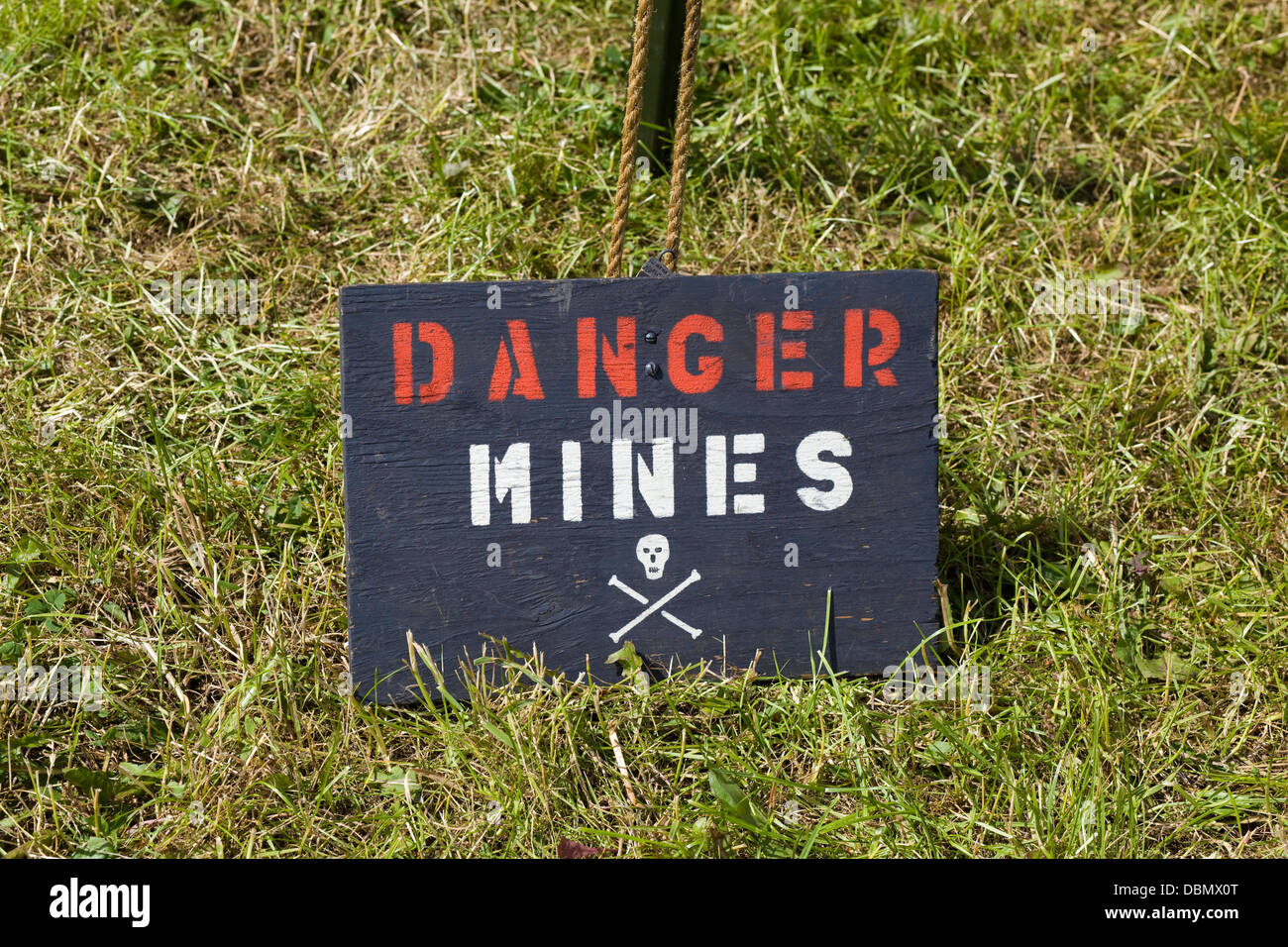 Black Warning Sign in Grass "Danger Mines" with Skull and crossbones ...