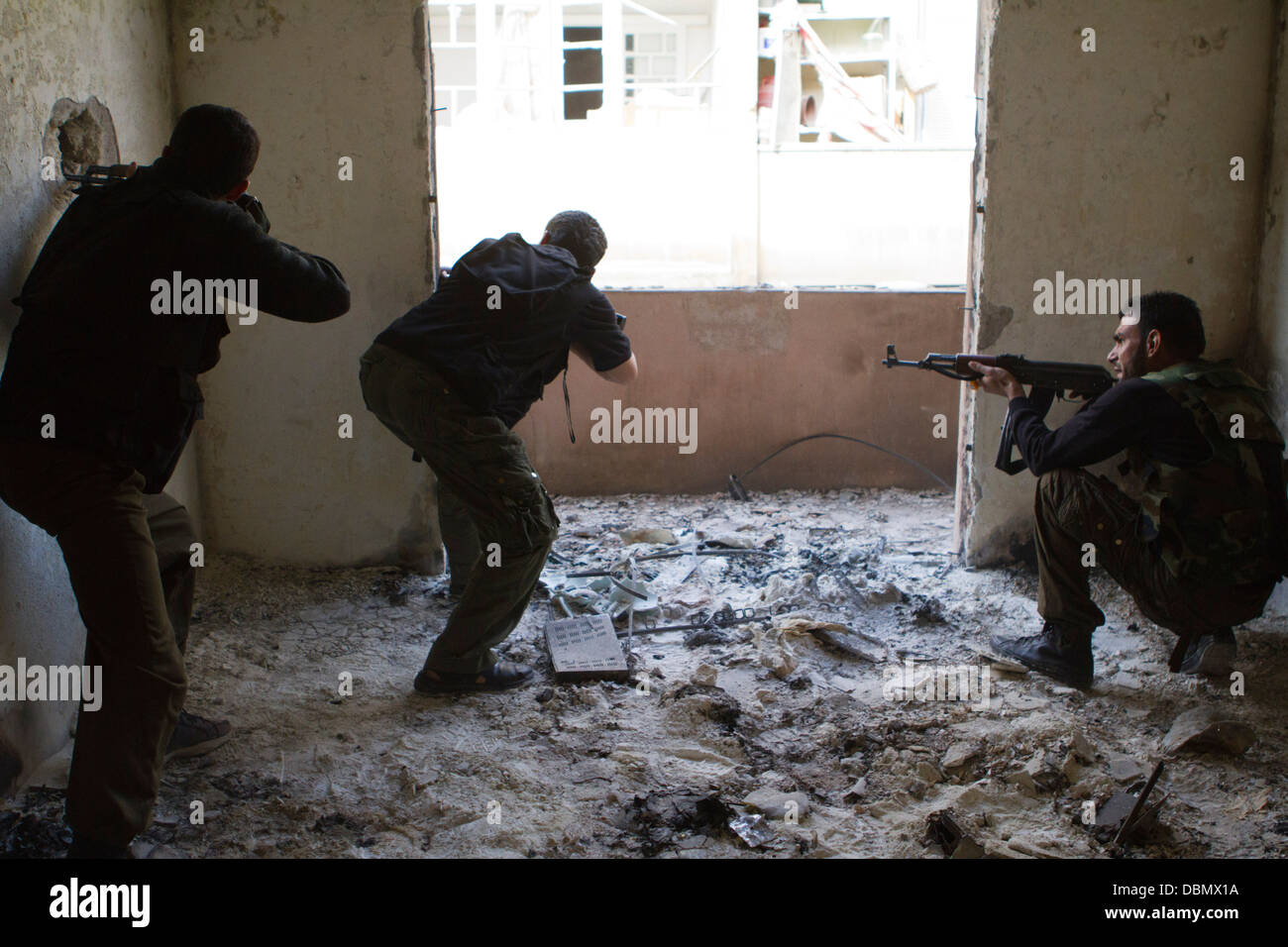 Aleppo, Syria: A Free Syrian Army member takes aim at a regime position ...