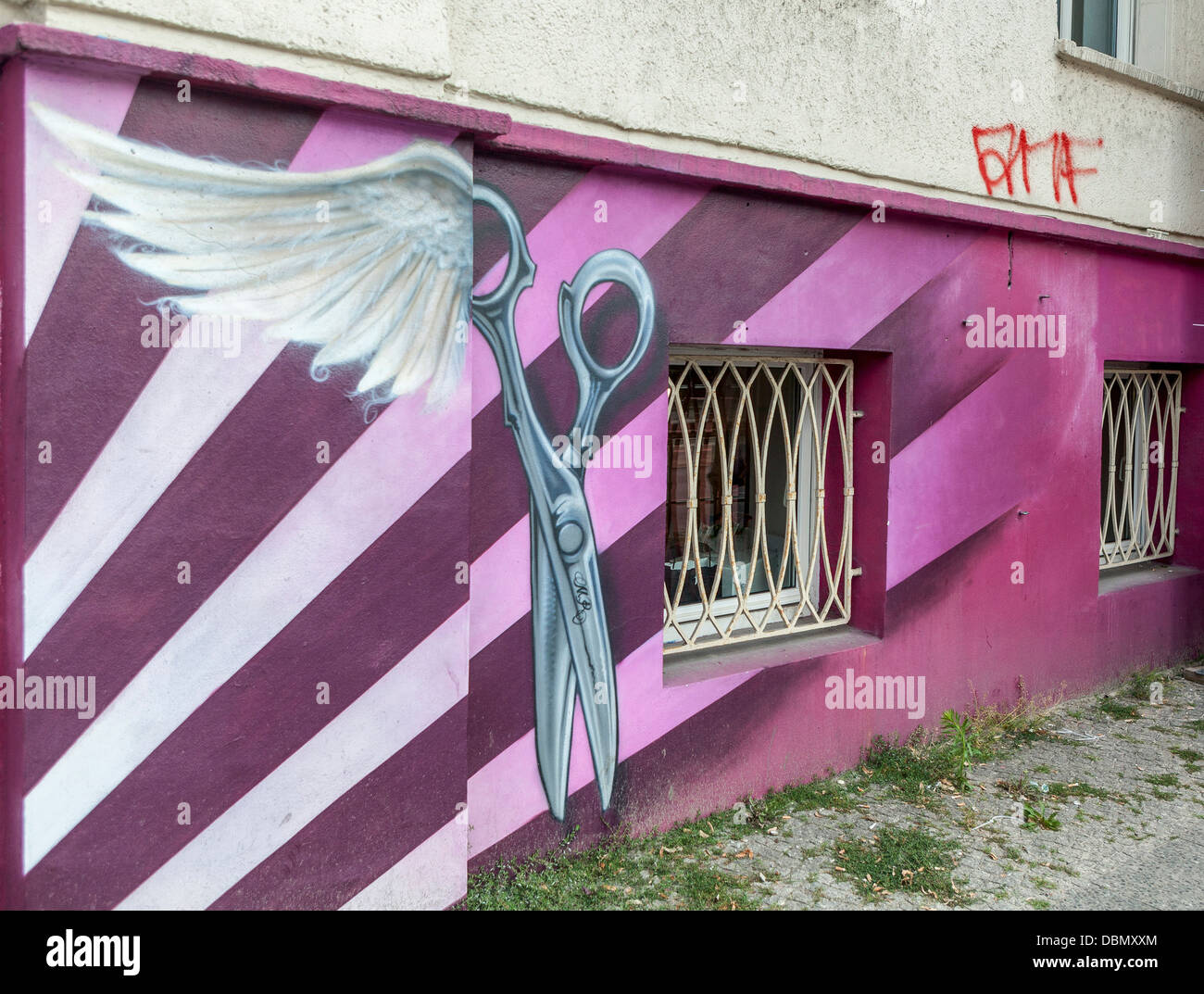 Mural of scissors and white wing in striped wall in Torstarsse - Mitte ...