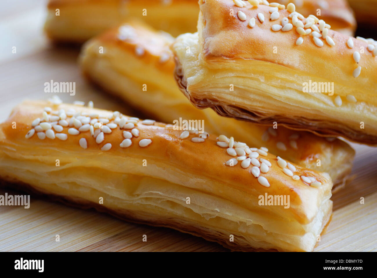 Just baked crunchy puff pastry on the wooden board Stock Photo - Alamy