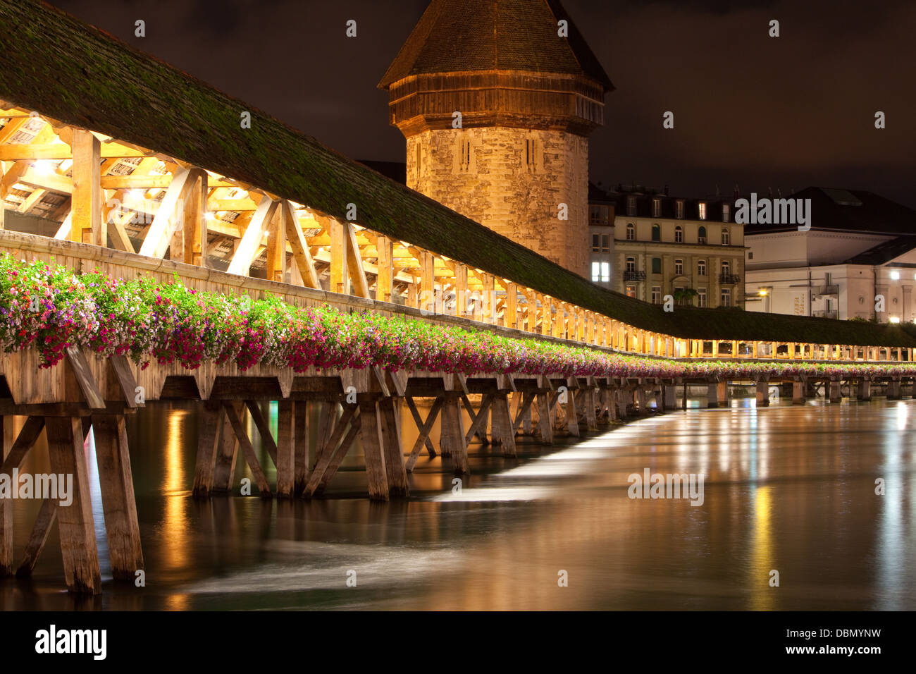 Historic Kapell bridge spanning a river (Reuss) in Lucerne Switzerland ...