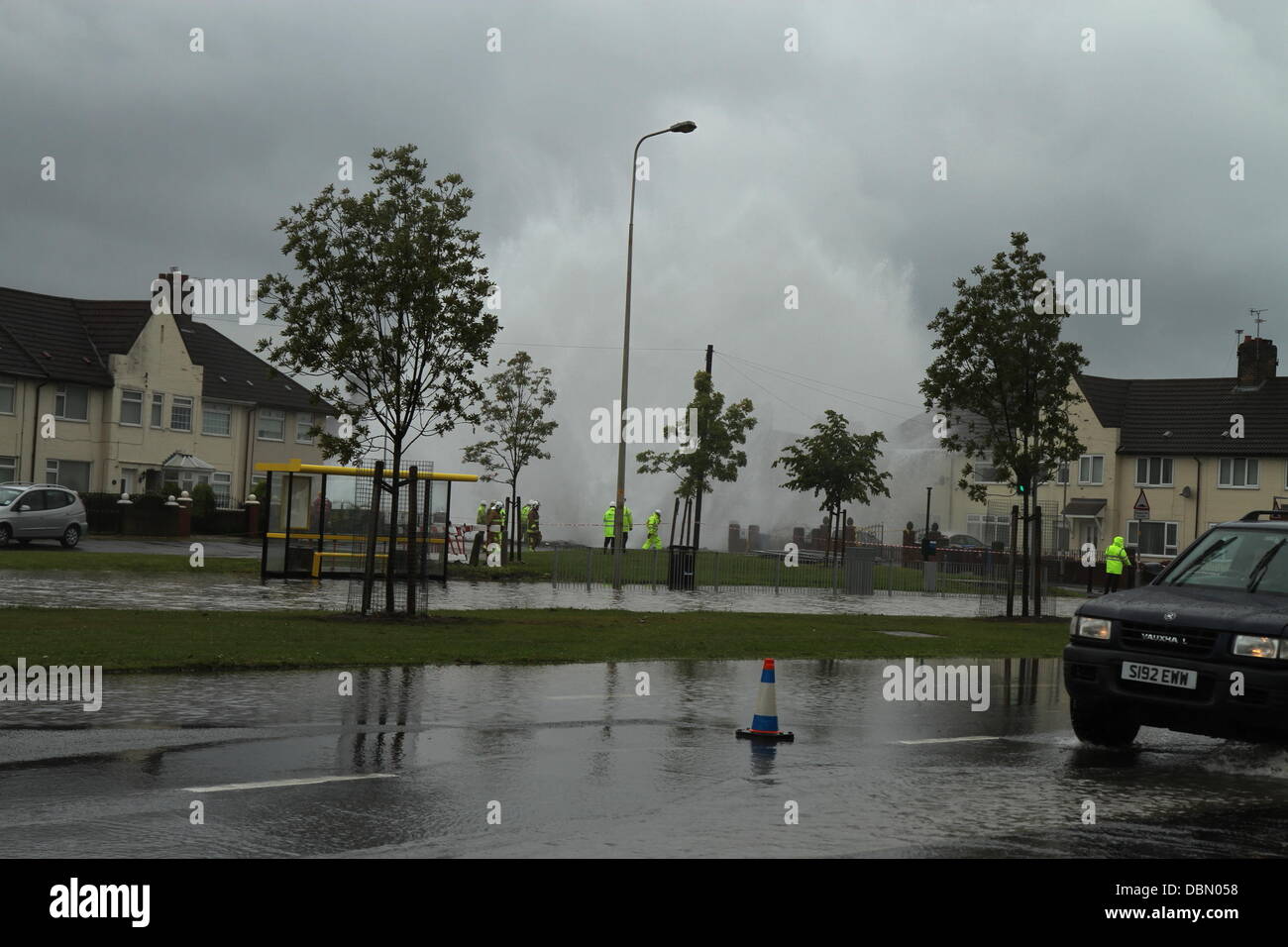 Burst water main causes flood chaos in Huyton area of Liverpool. A ...