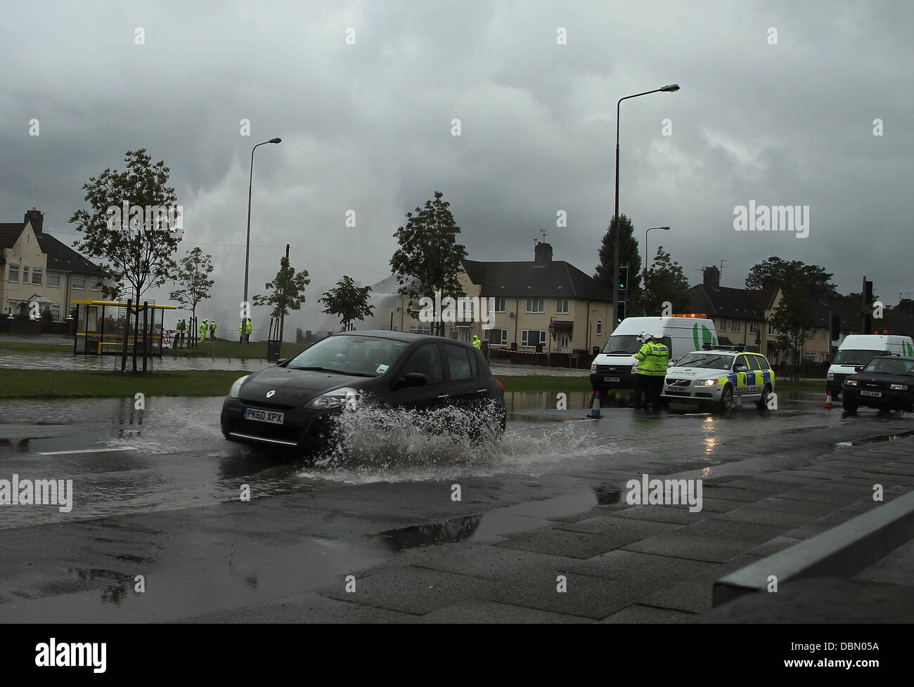Burst water main causes flood chaos in Huyton area of Liverpool. A ...