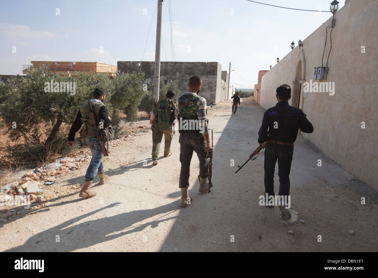 Free Syrian army members walk towards government positions near the ...