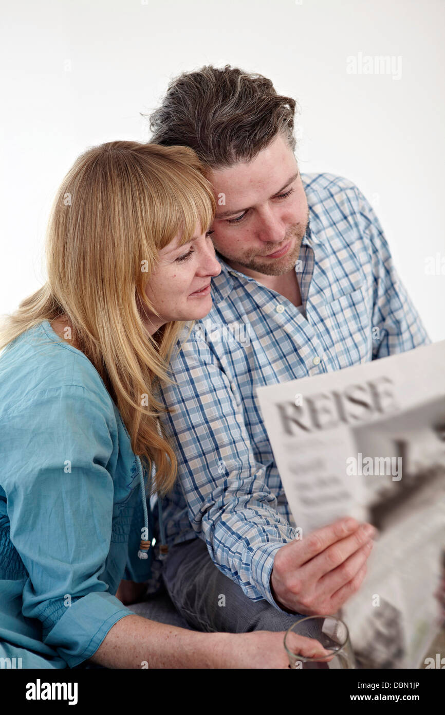 Couple Reading Newspaper Together Stock Photo - Alamy