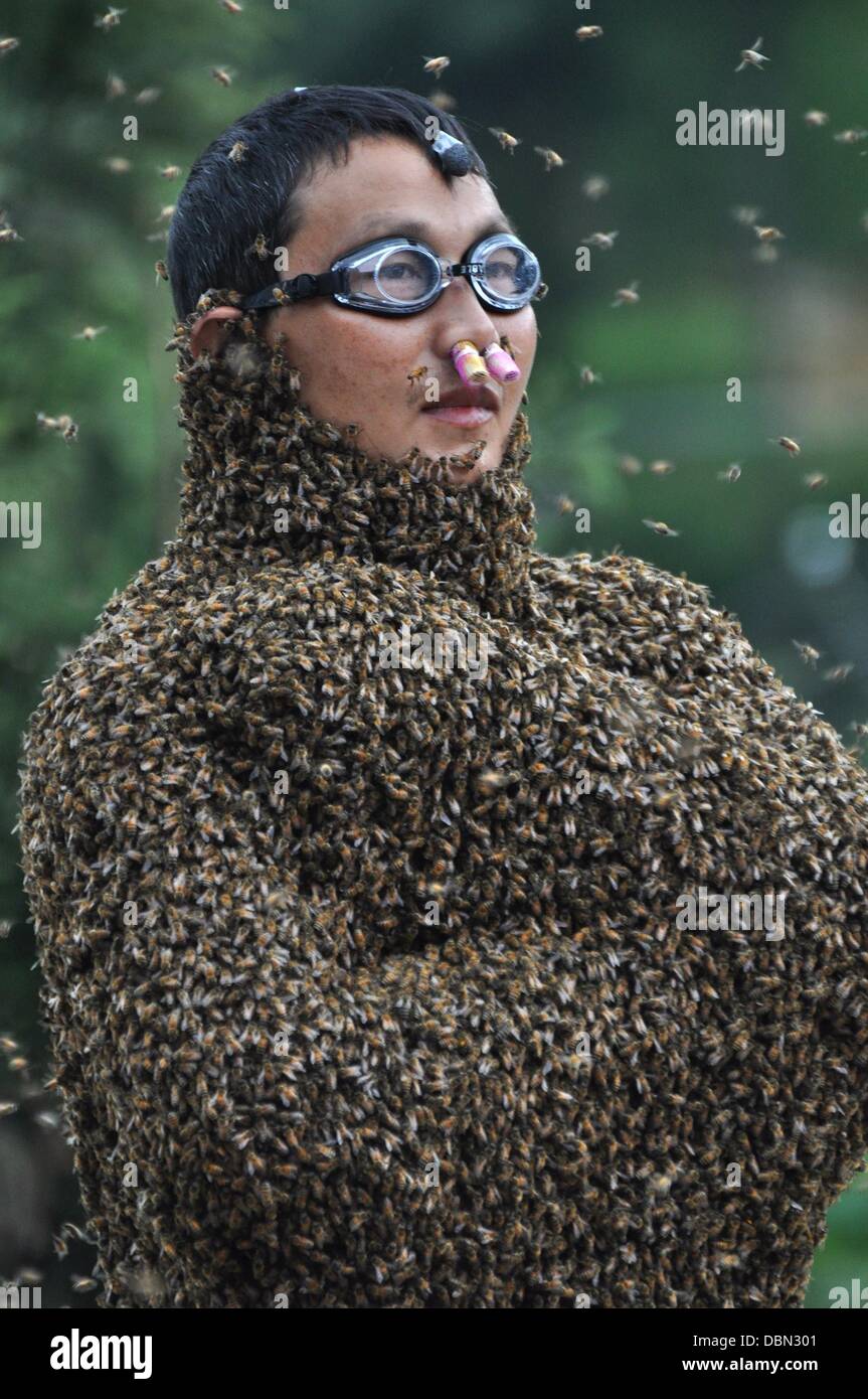 A day buzzing with competition.... Beekeepers Wang Dalin and Lu ...