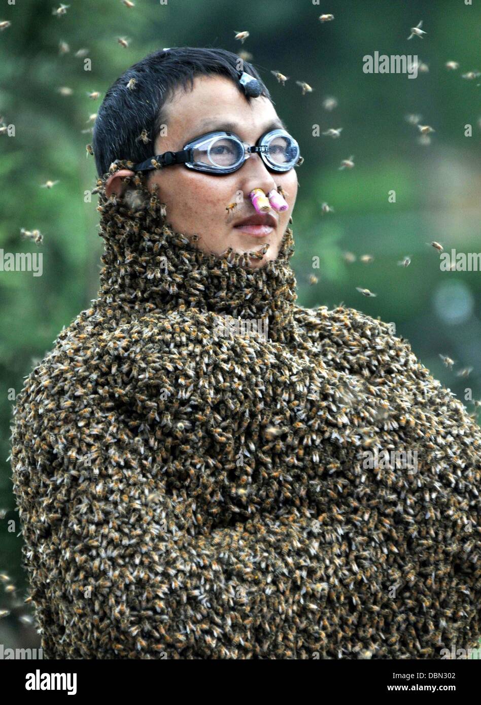 A day buzzing with competition.... Beekeepers Wang Dalin and Lu ...