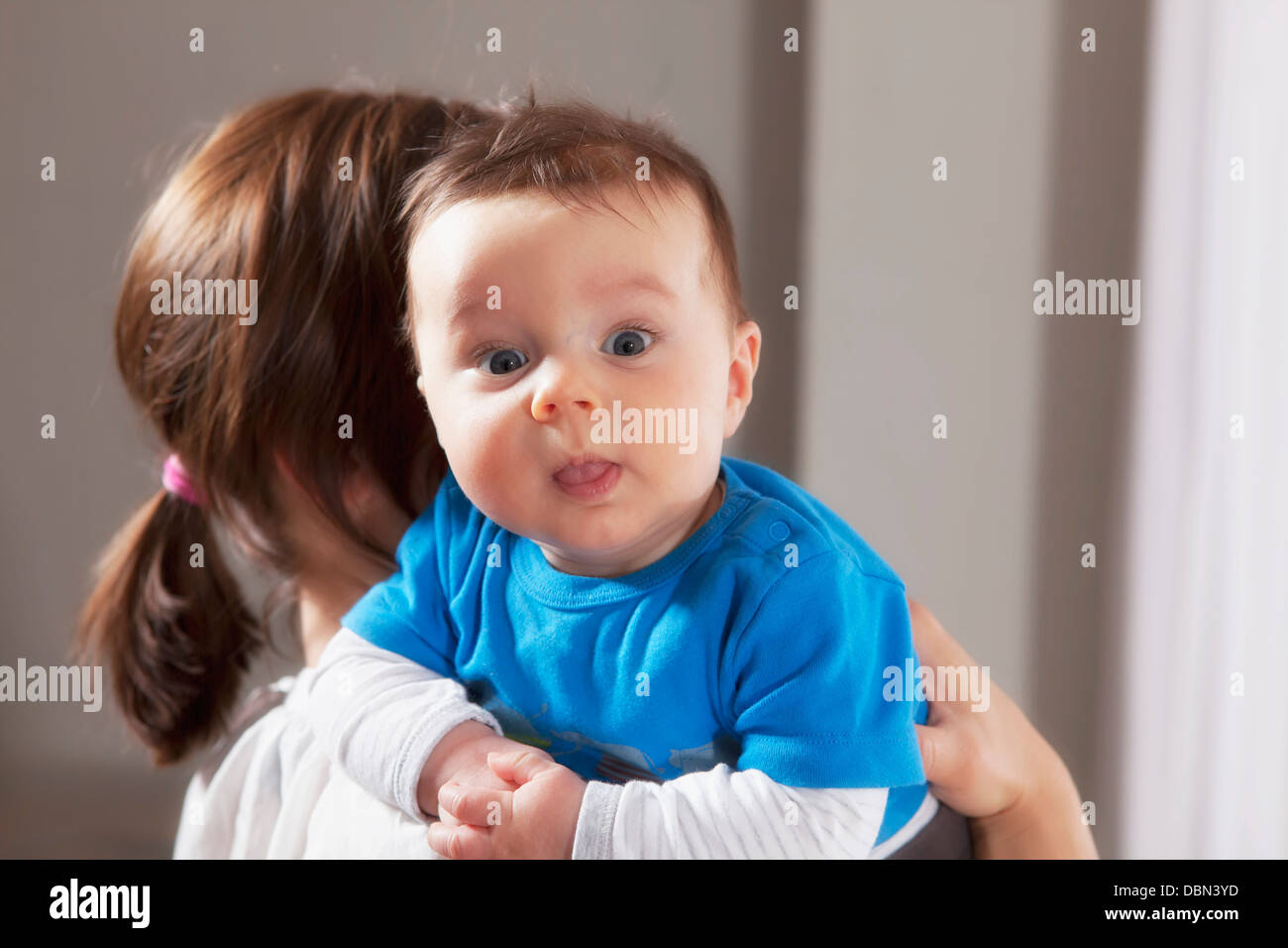 Woman carrying baby boy, Munich, Bavaria, Germany Stock Photo - Alamy