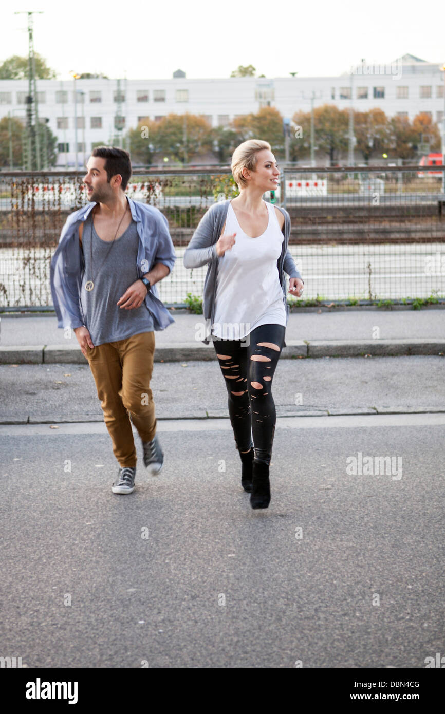 Couple running across hi-res stock photography and images - Alamy