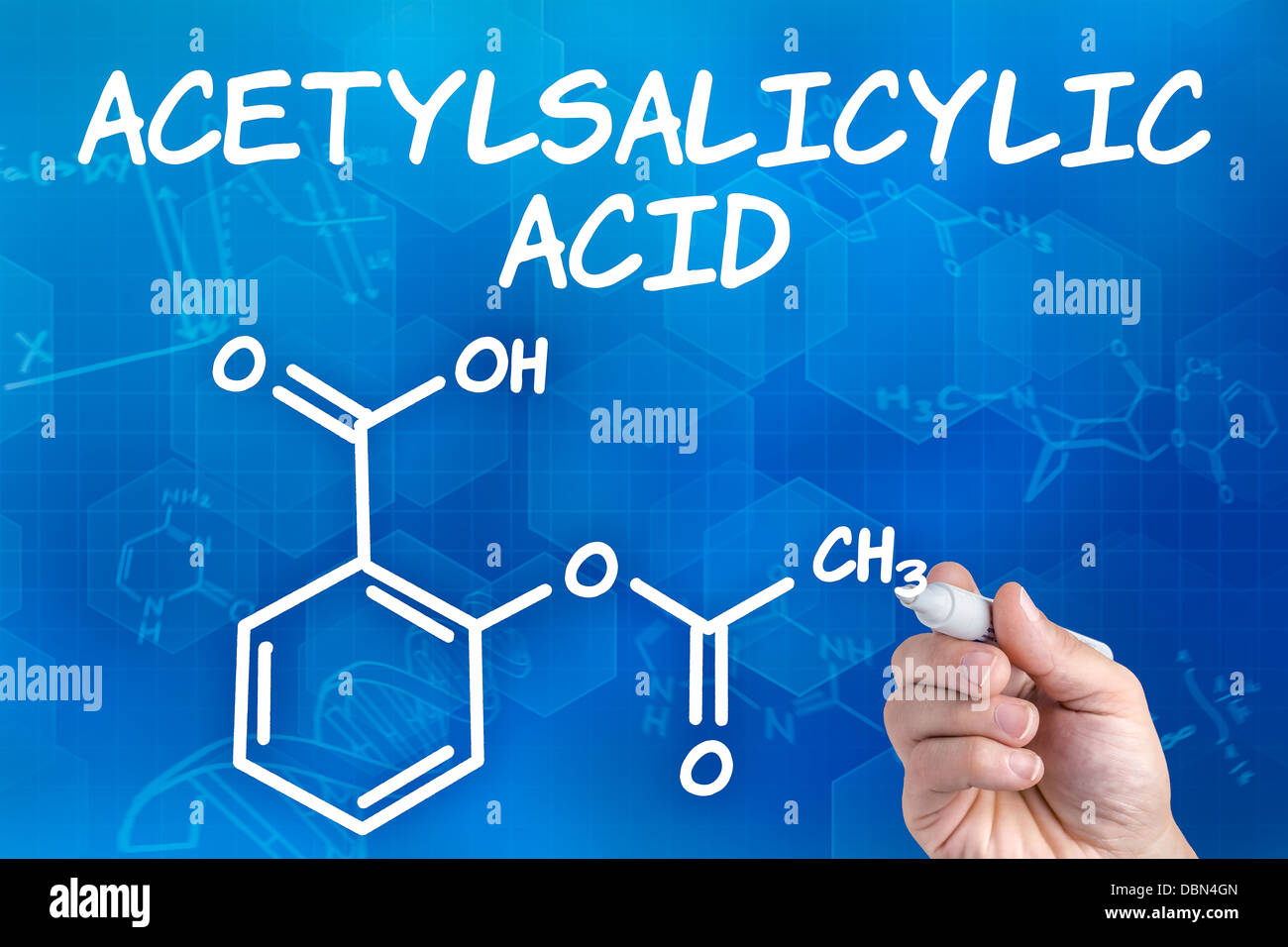 hand with pen drawing the chemical formula of acetylsalicylic acid ...