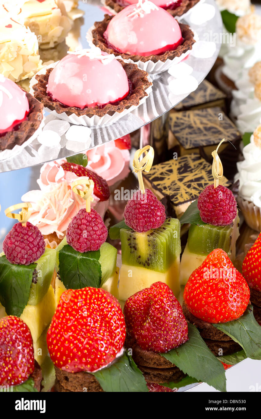 cream dessert and fruit on a table in a restaurant Stock Photo - Alamy