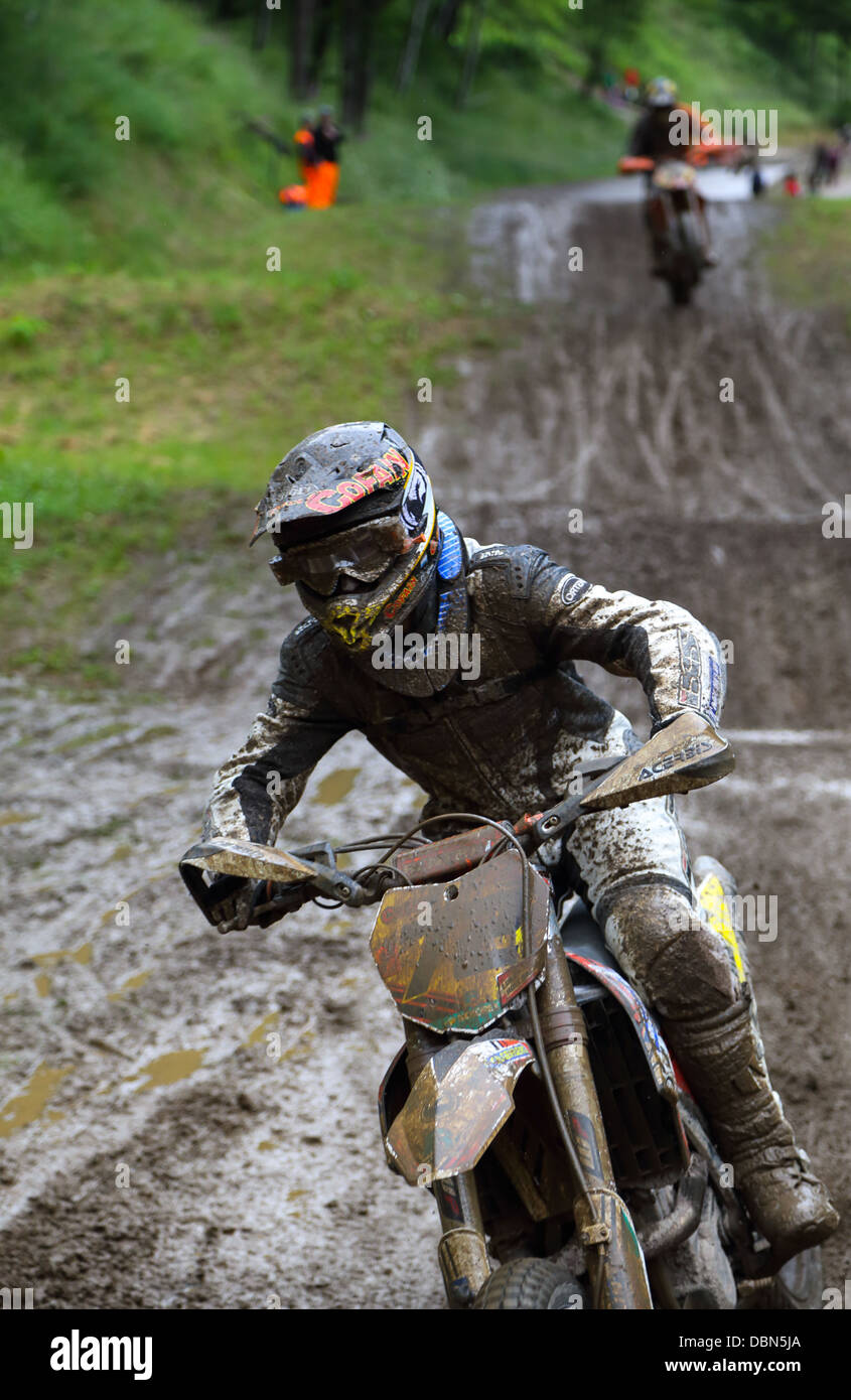 Muddy track for a supermoto race on the dirt part of the track. focused ...