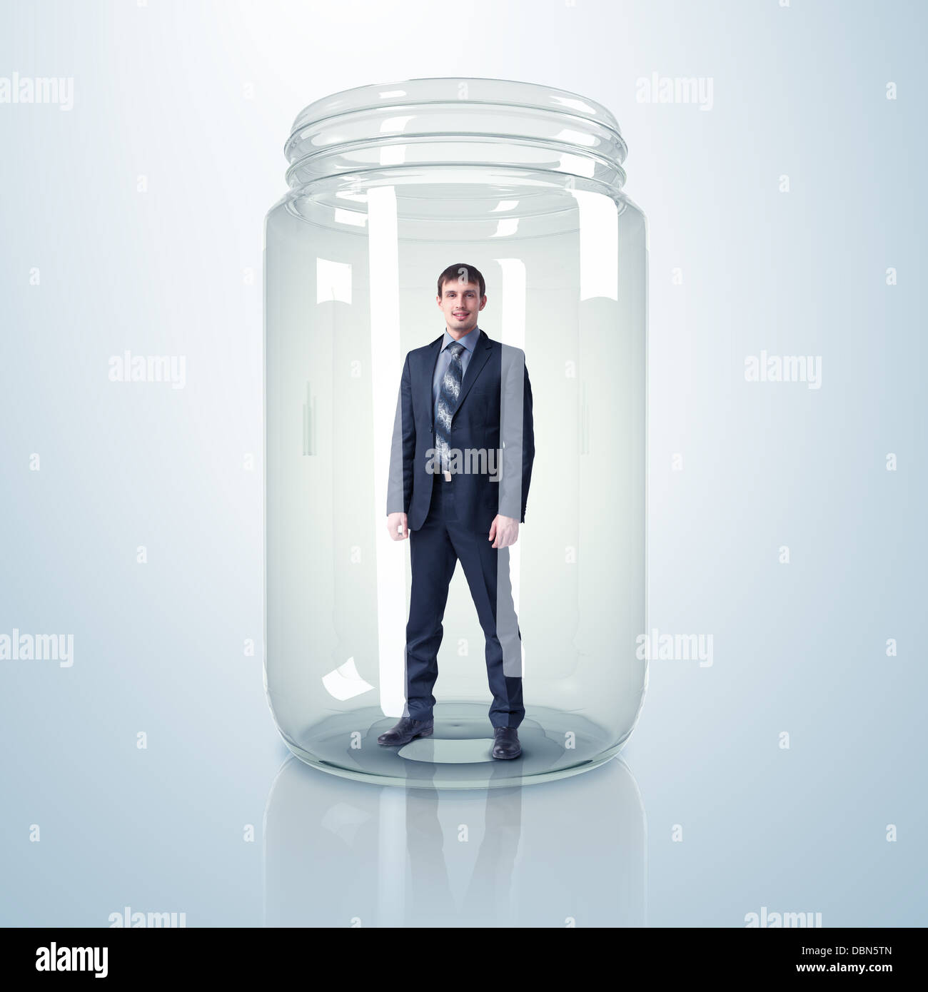 Businessman inside glass jar Stock Photo - Alamy
