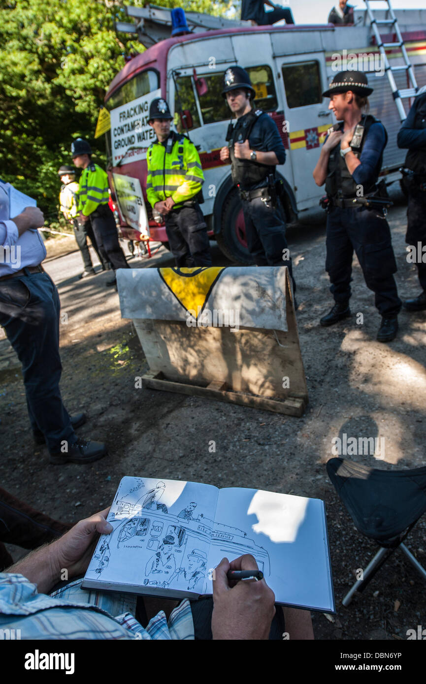 Balcombe, West Sussex, UK. 1st August 2013. An artist draws the scene ...